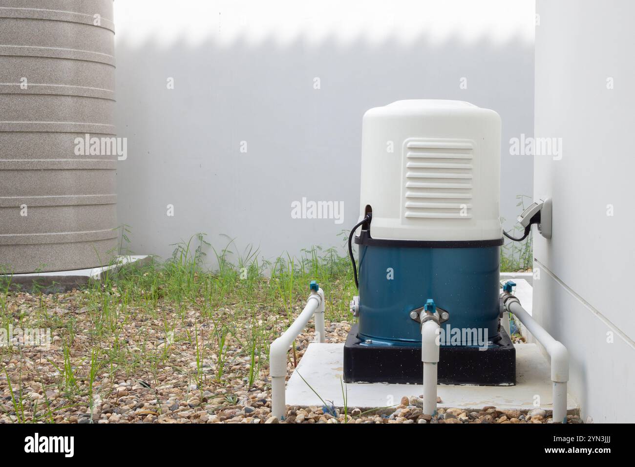 automatic water pump station outside the house Stock Photo - Alamy