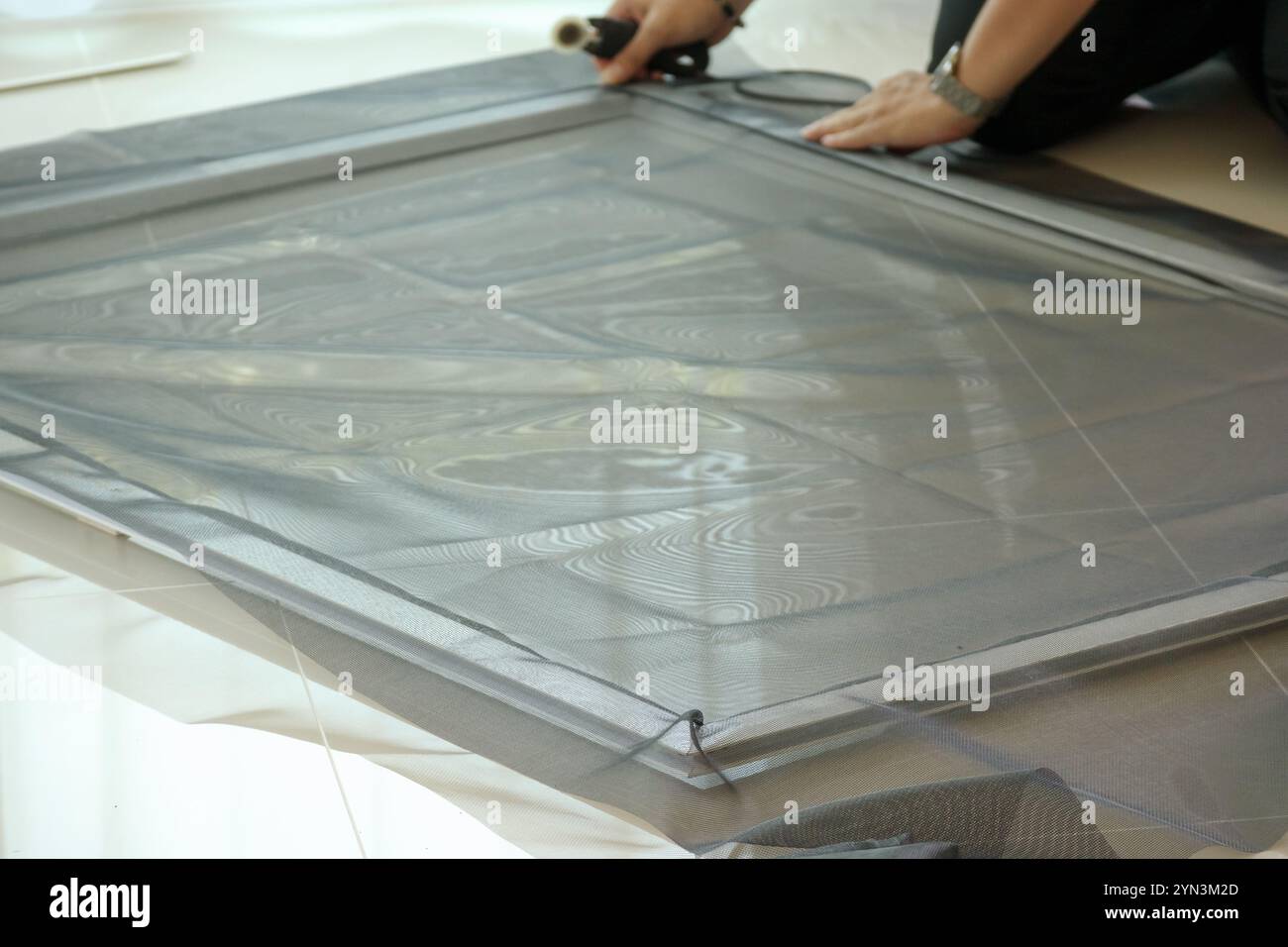 man install mosquito net wire screen on house window protection against ...