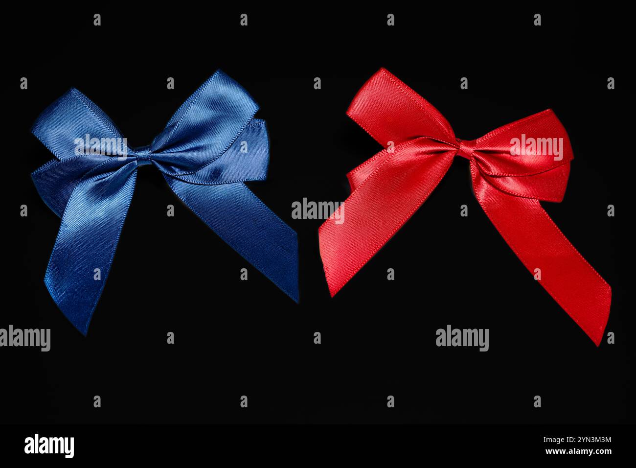 blue and red ribbon on black background Stock Photo - Alamy