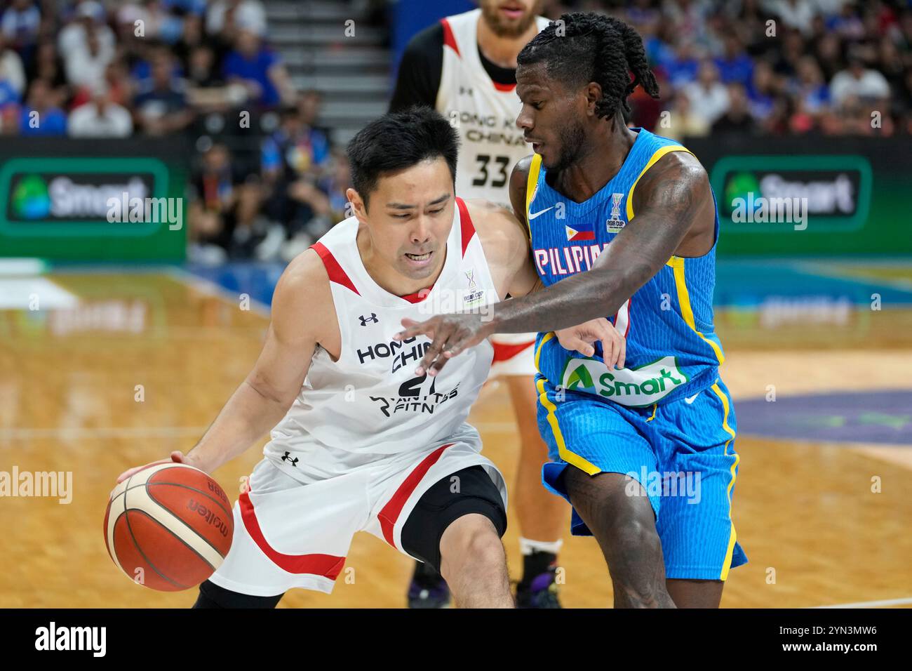 Hong Kong's Tsai Choi Kwan, left, against Philippines' CJ Perez during ...