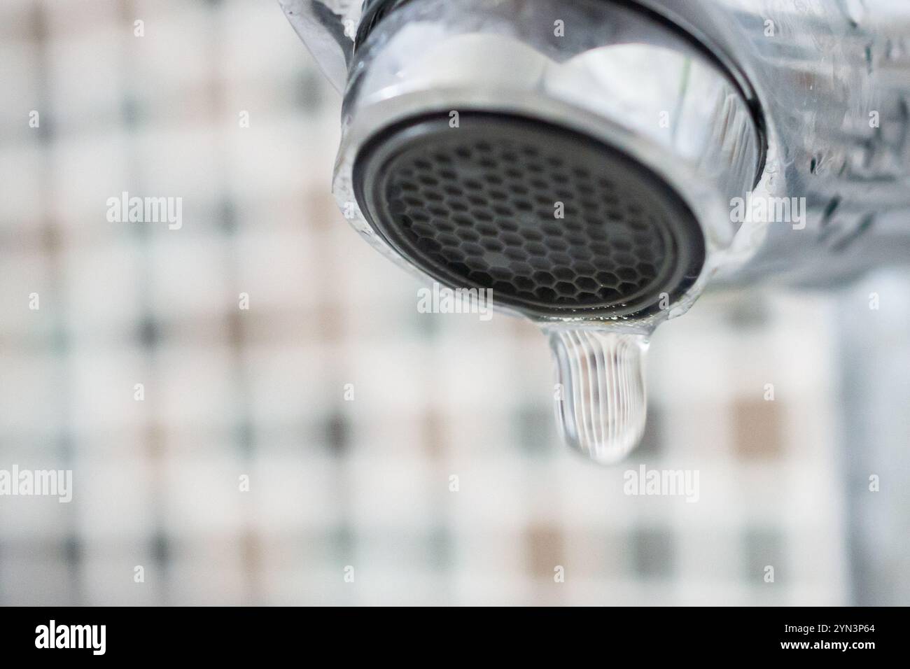 Close up faucet with water drop Stock Photo - Alamy