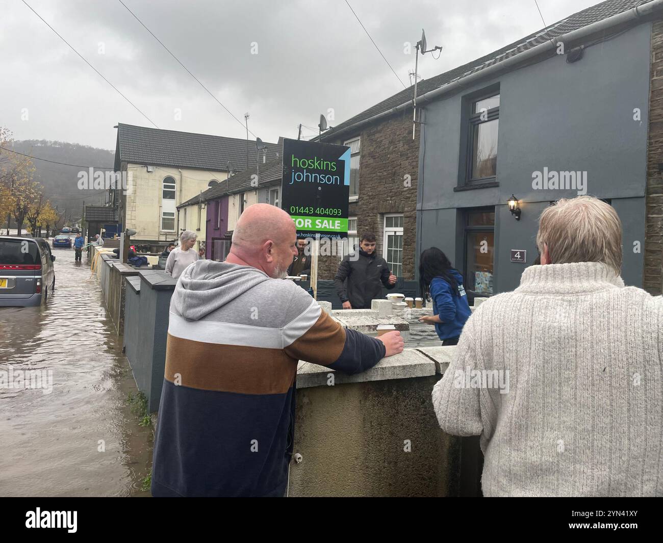 Residents attend to their properties on Sion Street in Pontypridd ...