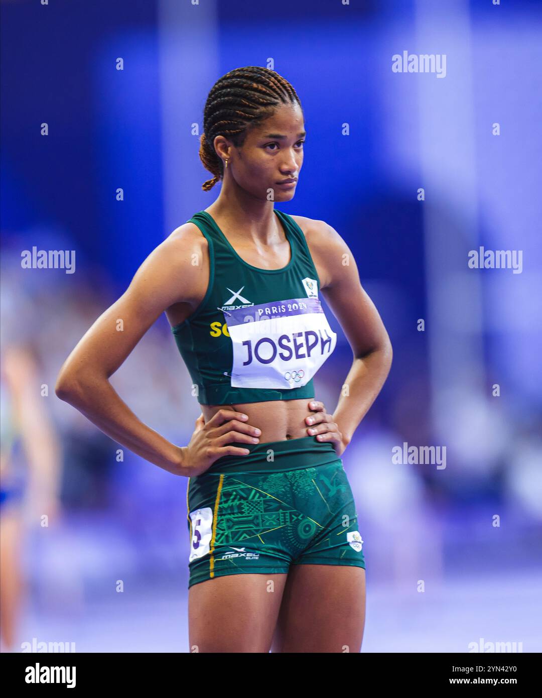 Rogail Joseph participating in the 400 meters hurdles at the Paris 2024 ...