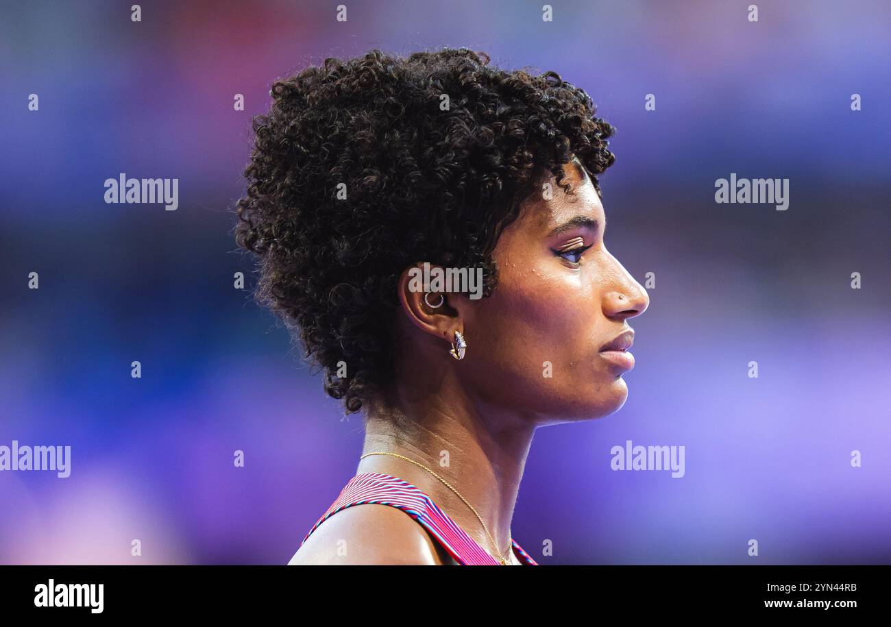 Anna Cockrell participating in the 400 meters hurdles at the Paris 2024 ...