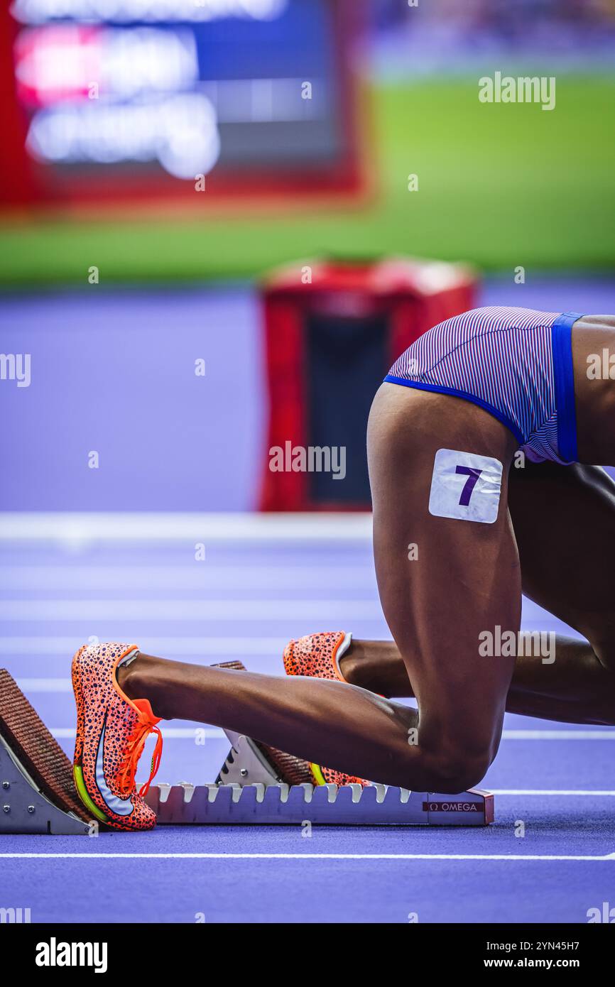Anna Cockrell participating in the 400 meters hurdles at the Paris 2024 ...