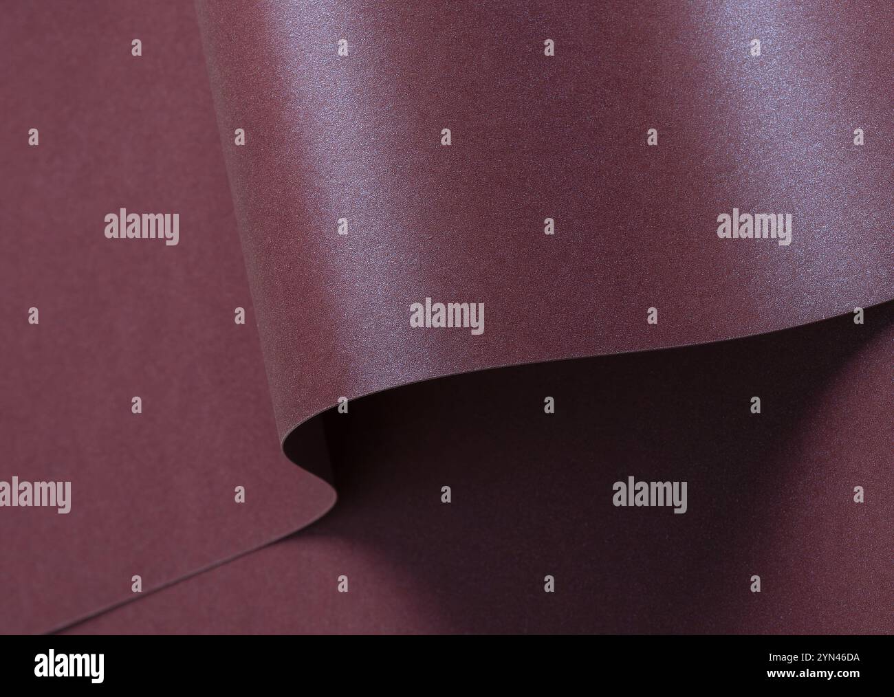 Burgundy metallic paper background with a shimmering, sleek surface and ...