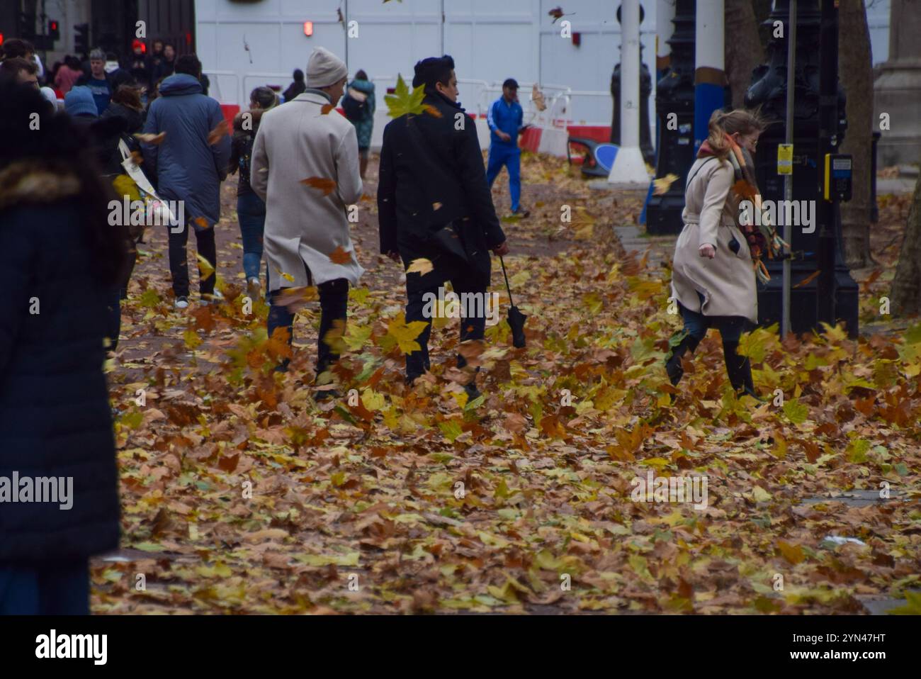 November 24, 2024, London, England, UK: People walk along the Mall ...