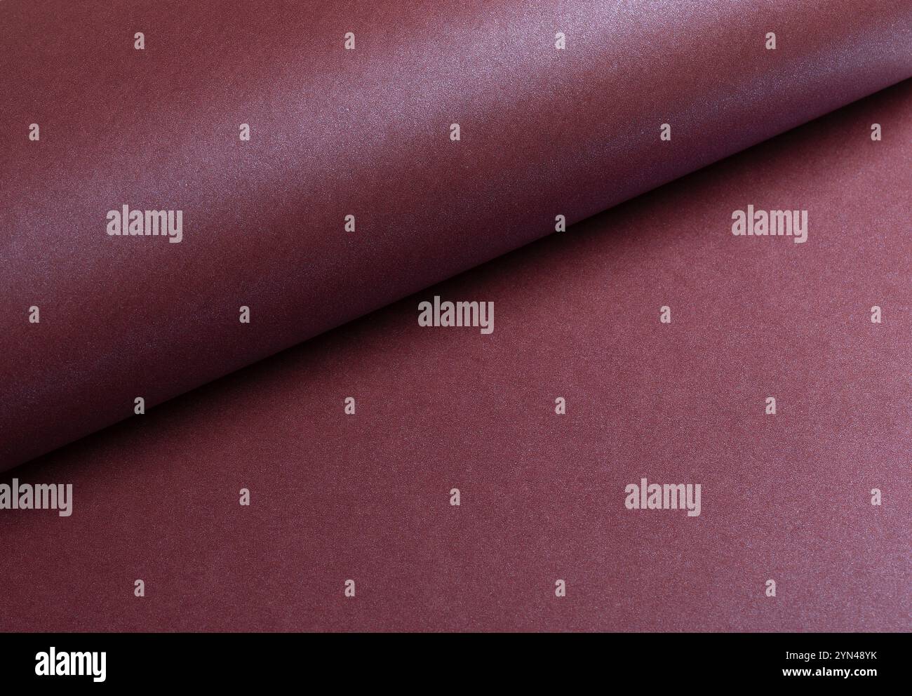 Metallic burgundy paper background with a smooth, shimmering surface ...