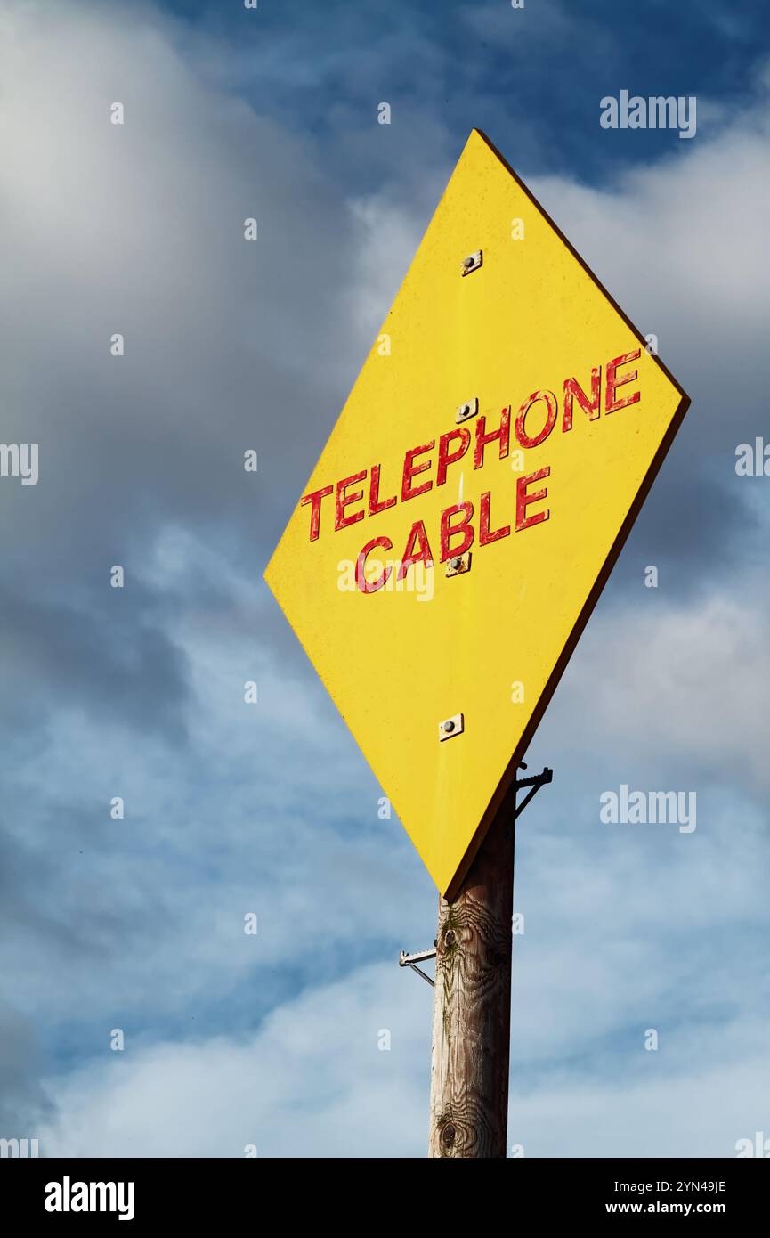 Diamond Shape Yellow Painted Warning Sign On A Wooden Pole For An ...