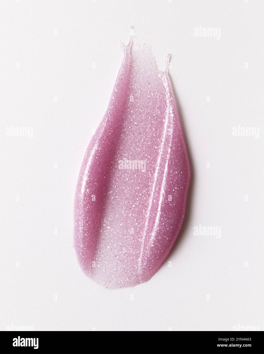 Pink shimmering lipgloss texture isolated on white background. Smudged ...