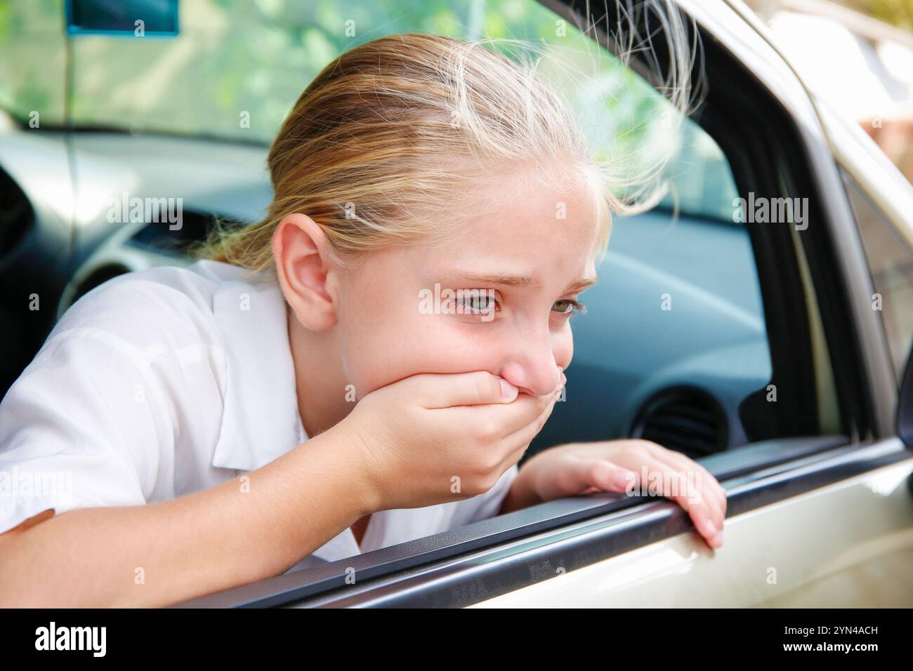 The child was carsick, the girl is sick Stock Photo - Alamy