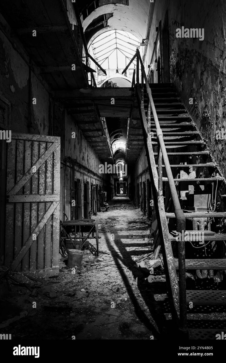 decrepit cell block and stairs leading to upper level at Eastern State ...