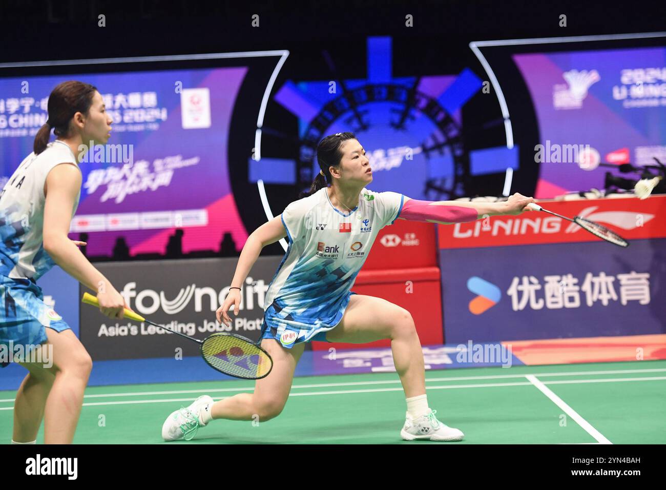 Shenzhen, China's Guangdong Province. 24th Nov, 2024. Li Yijing/Luo Xumin (R) compete during the ...