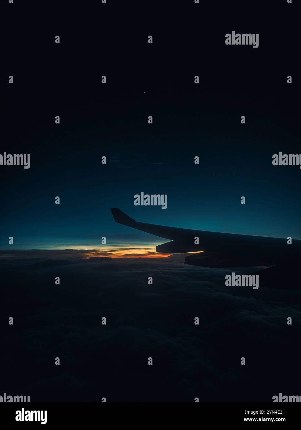 Aerial View of Airplane Wing at Sunset Over Clouds, Serene Travel Scene in Twilight Sky Stock ...