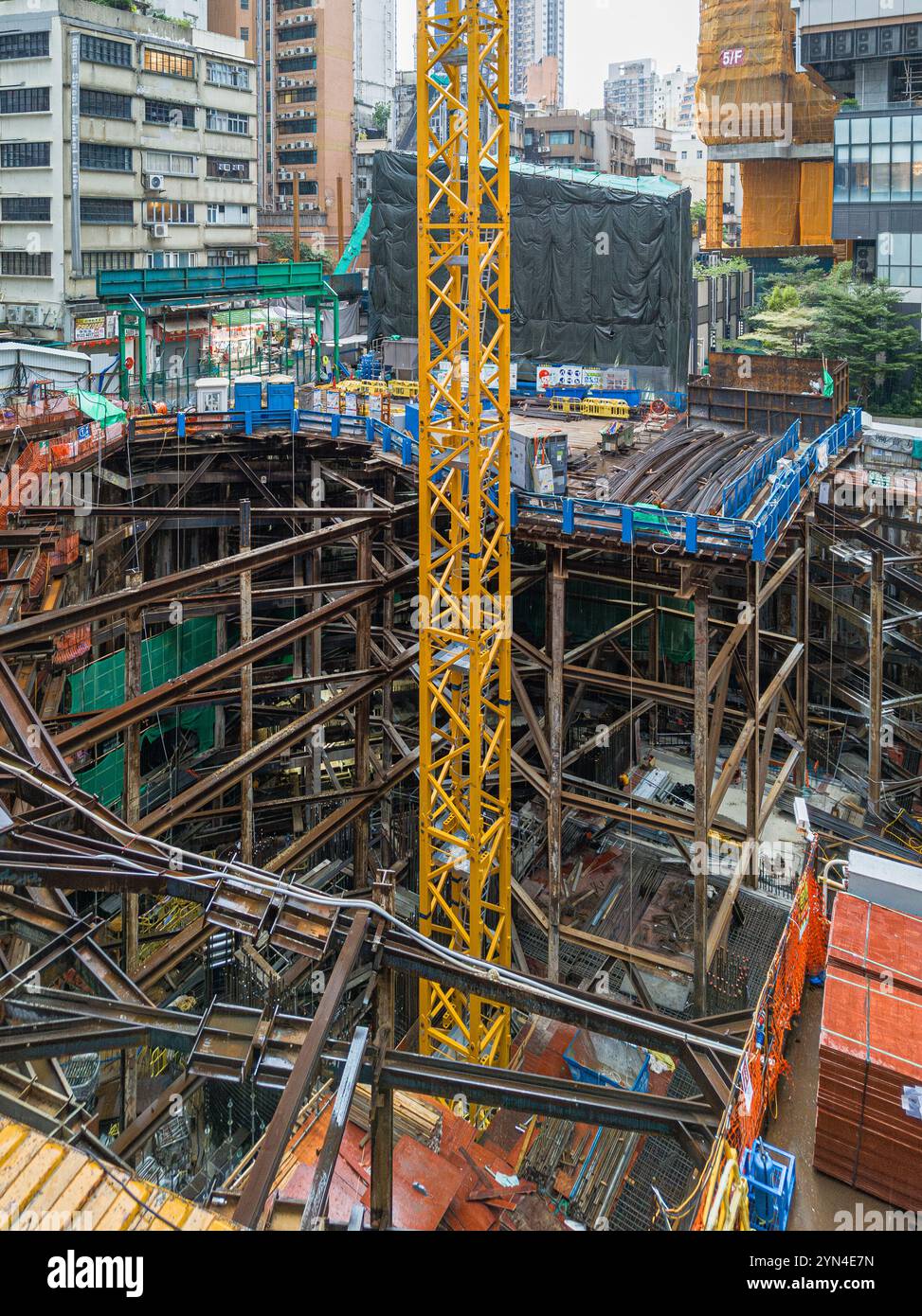 Urban Construction Site with Steel Framework and Tower Crane in Hong Kong - Modern Development ...