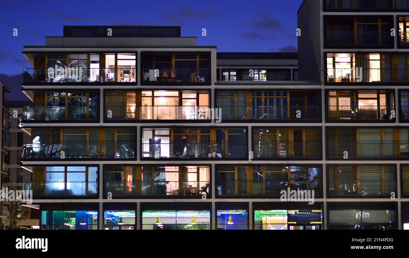 The facade of a residential building in the night. Modern architecture ...