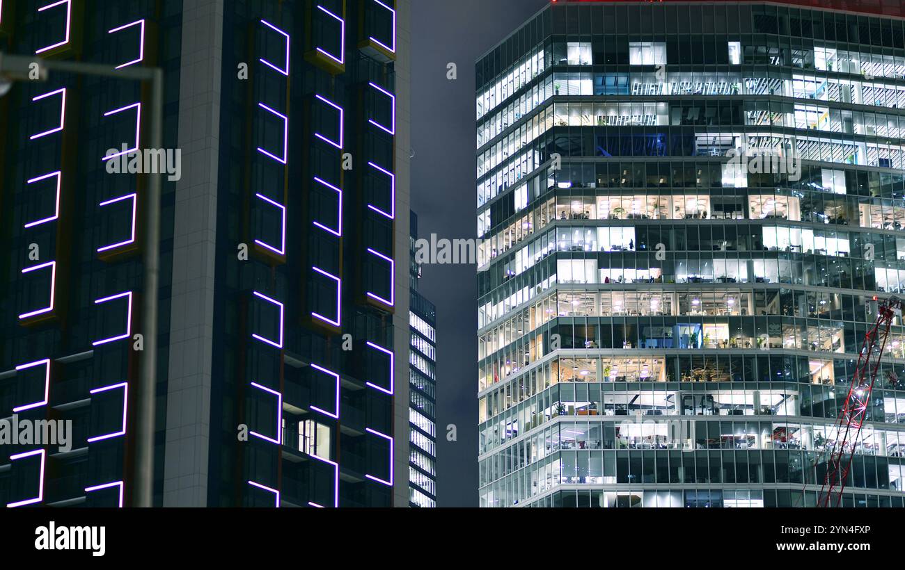 Night architecture, skyscrapers with glass facade. Modern buildings in ...
