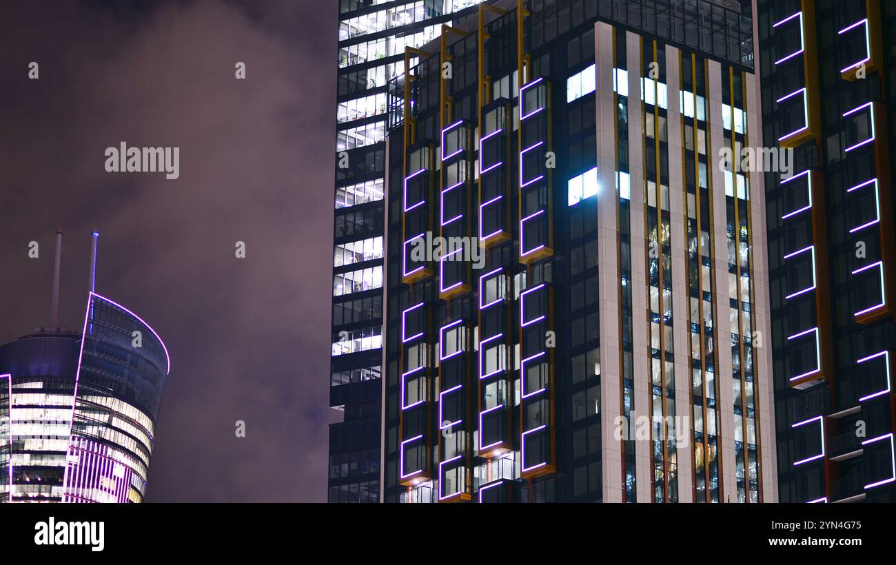 Night architecture, skyscrapers with glass facade. Modern buildings in ...