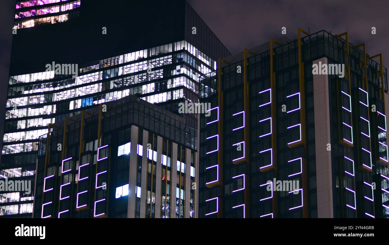 Night architecture, skyscrapers with glass facade. Modern buildings in ...