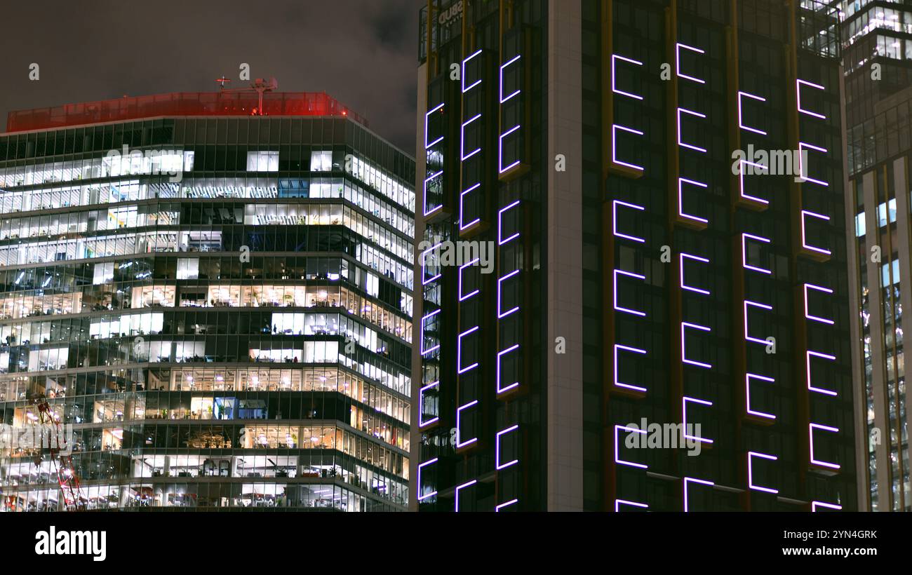 Night architecture, skyscrapers with glass facade. Modern buildings in ...