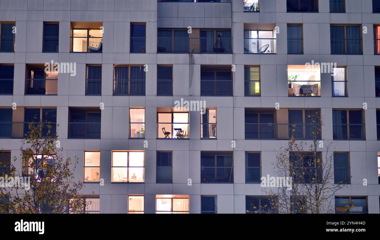 The facade of a residential building in the night. Modern architecture ...