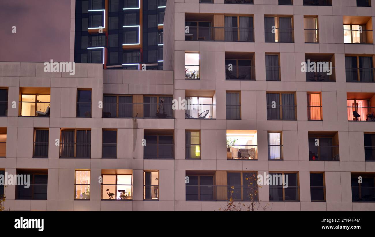 The facade of a residential building in the night. Modern architecture ...