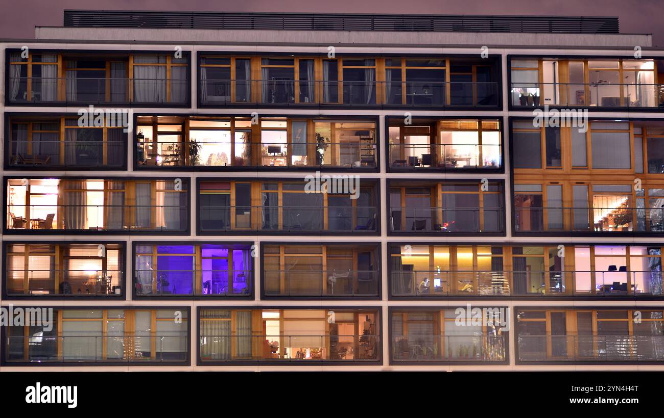 The facade of a residential building in the night. Modern architecture ...