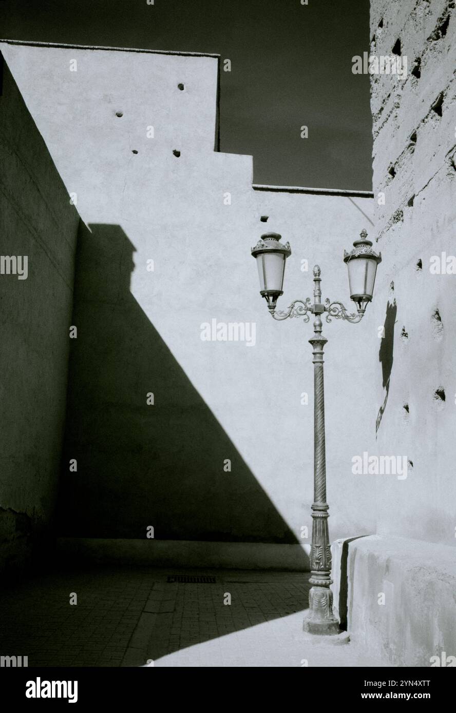 Old traditional gaslight against the ancient strong walls of the medina ...