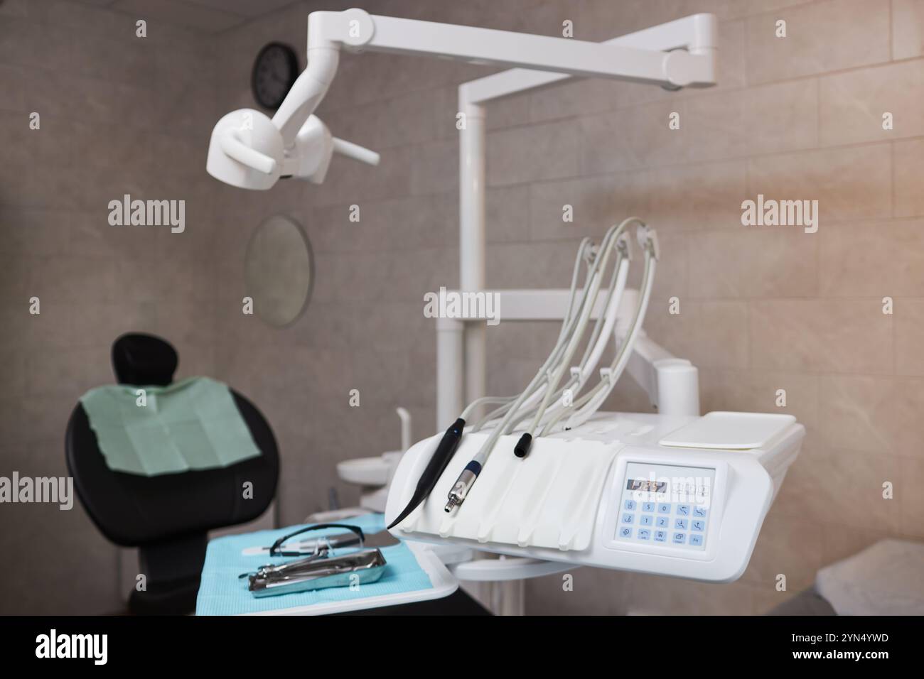 Modern Dental Office Chair and Equipment Surrounding Stock Photo - Alamy