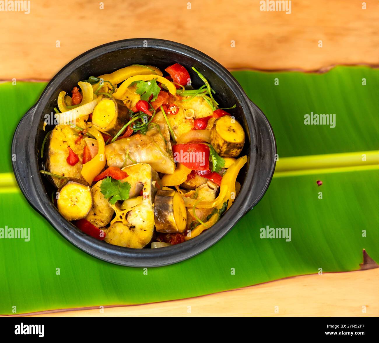 Typical Brazilian tropical fish stew with palm oil, coconut milk and ...