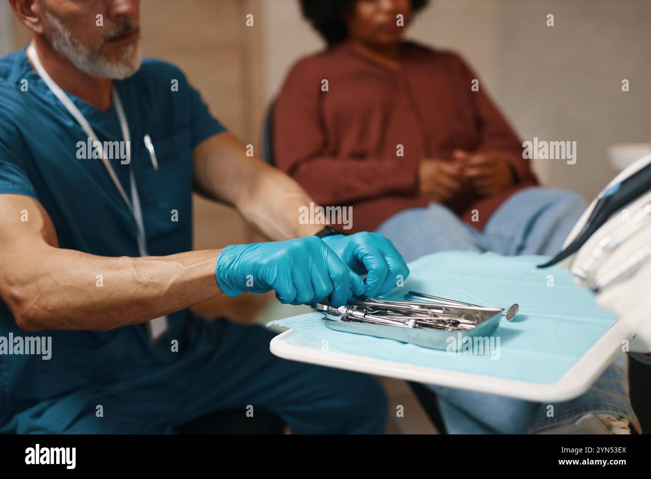 Dentist preparing instruments procedure hi-res stock photography and ...