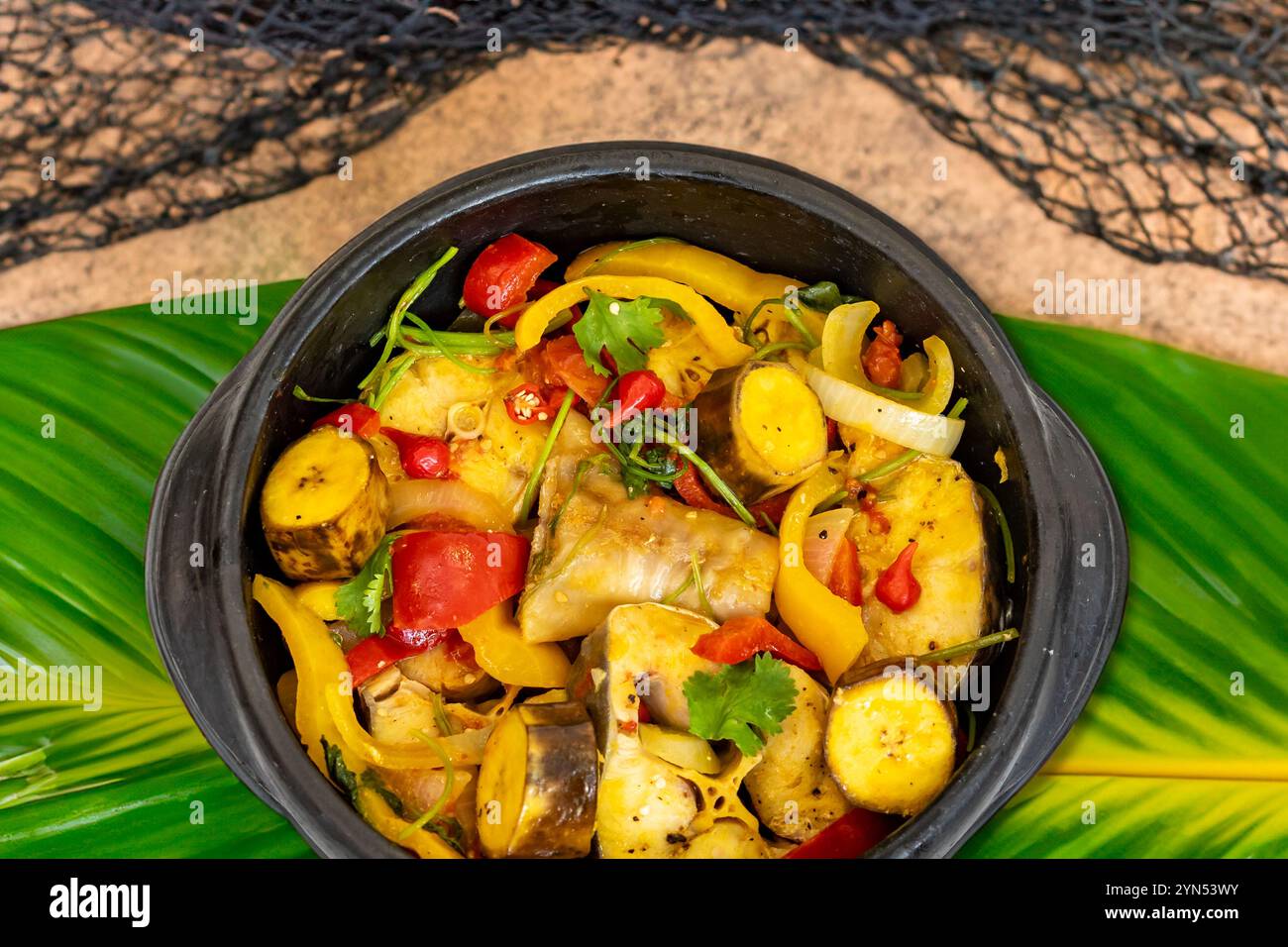 Typical Brazilian tropical fish stew with palm oil, coconut milk and ...