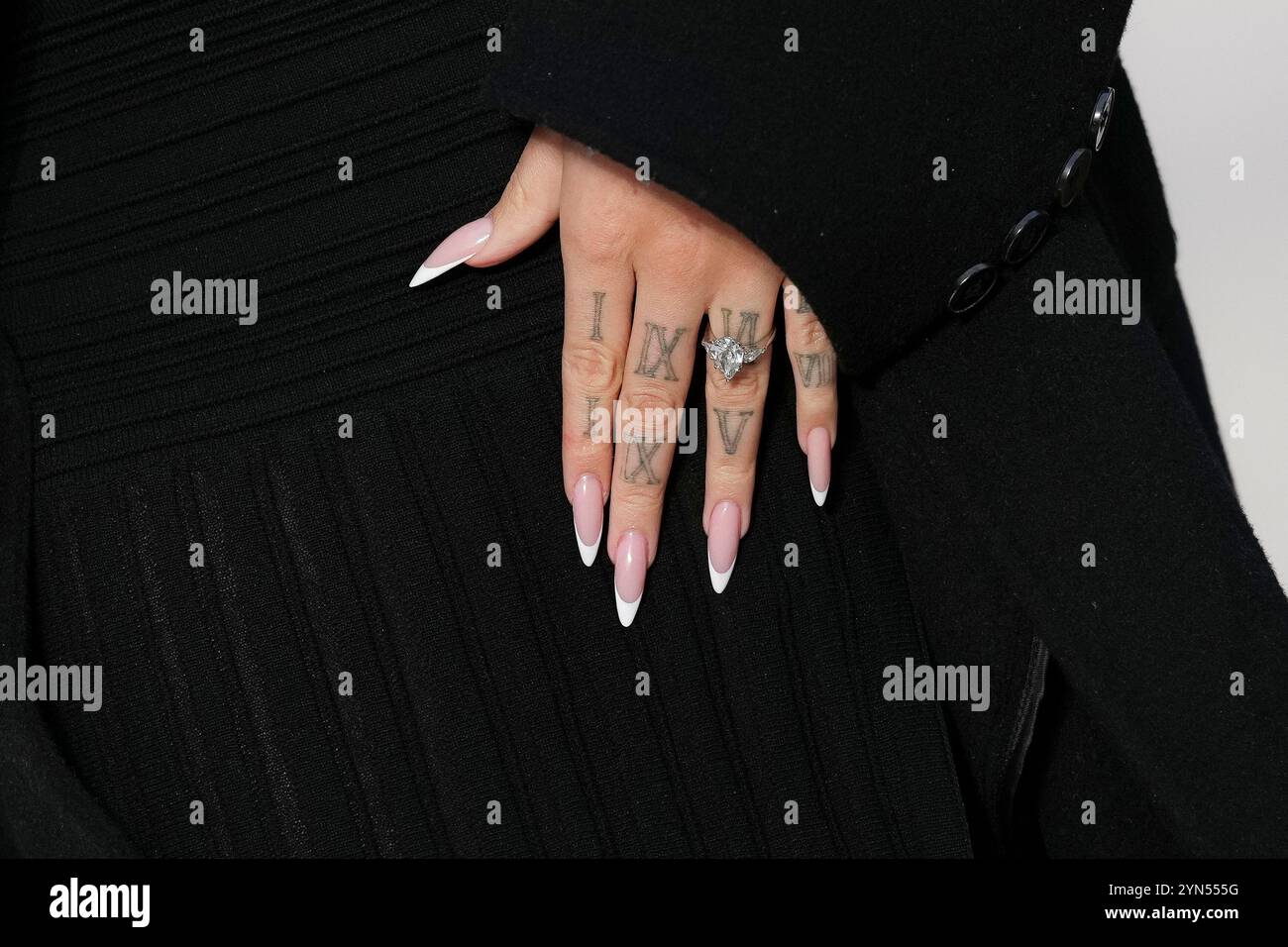 The ring on the hand of Mabel as she poses for photographers upon ...