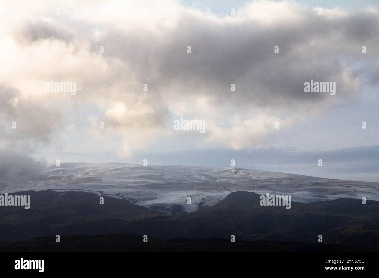 A majestic Icelandic glacier stretching across the landscape, with its ...