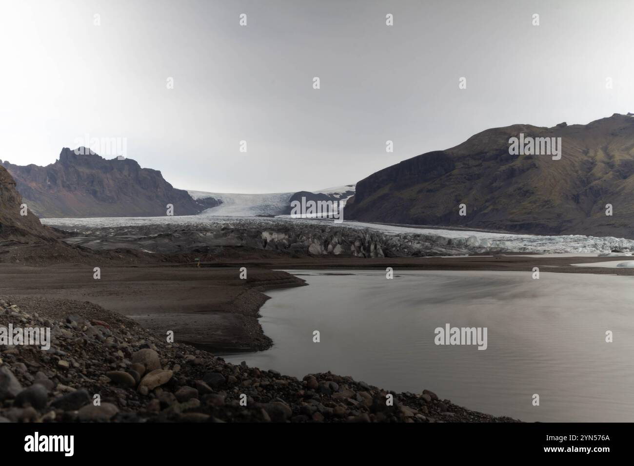A majestic Icelandic glacier stretching across the landscape, with its ...