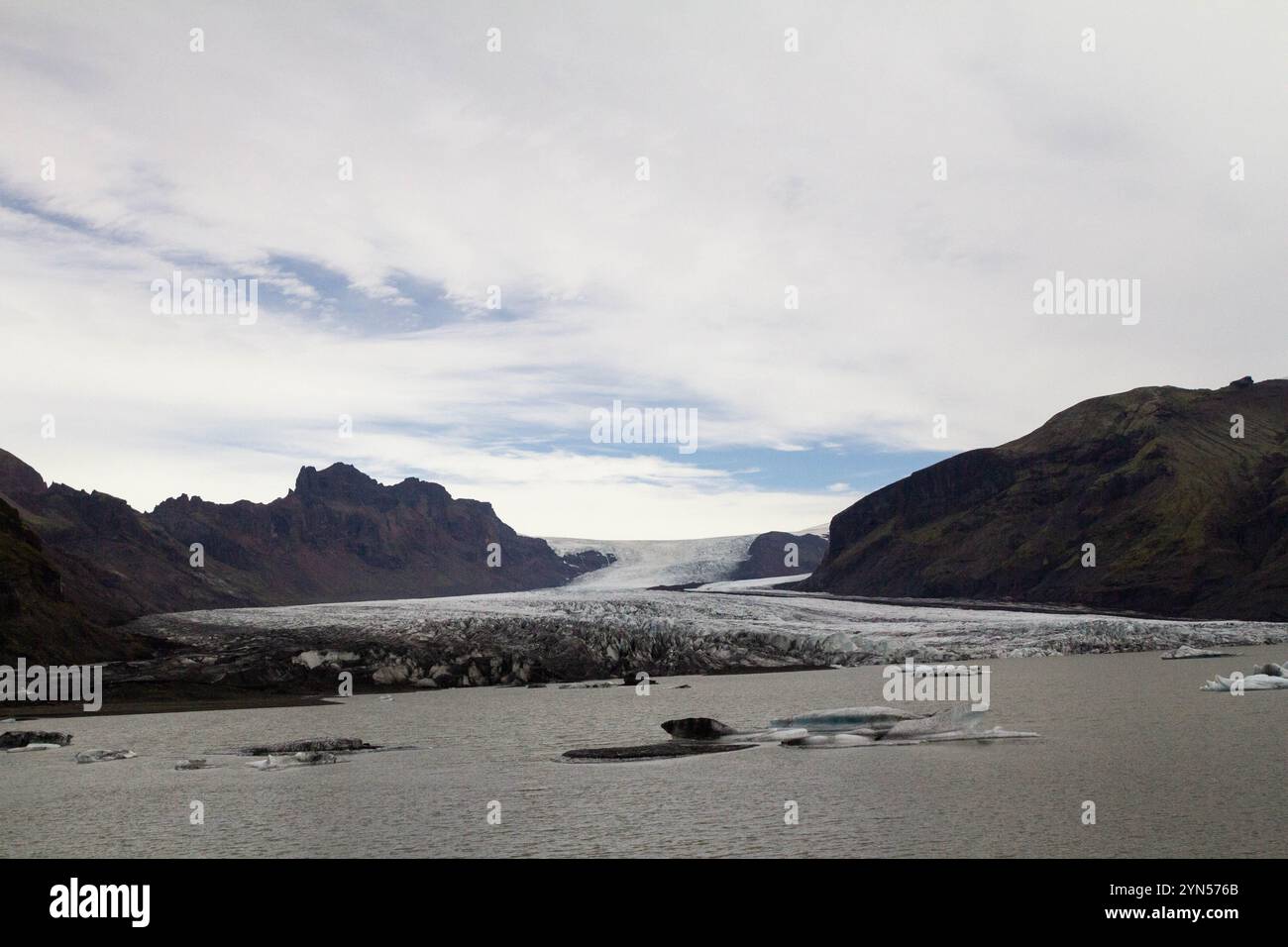 A majestic Icelandic glacier stretching across the landscape, with its ...