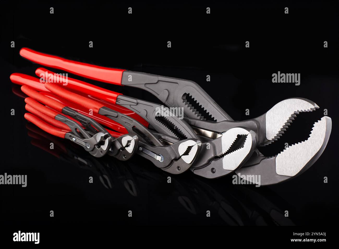 Set of Adjustable Wrenches with Red Handles Stock Photo - Alamy