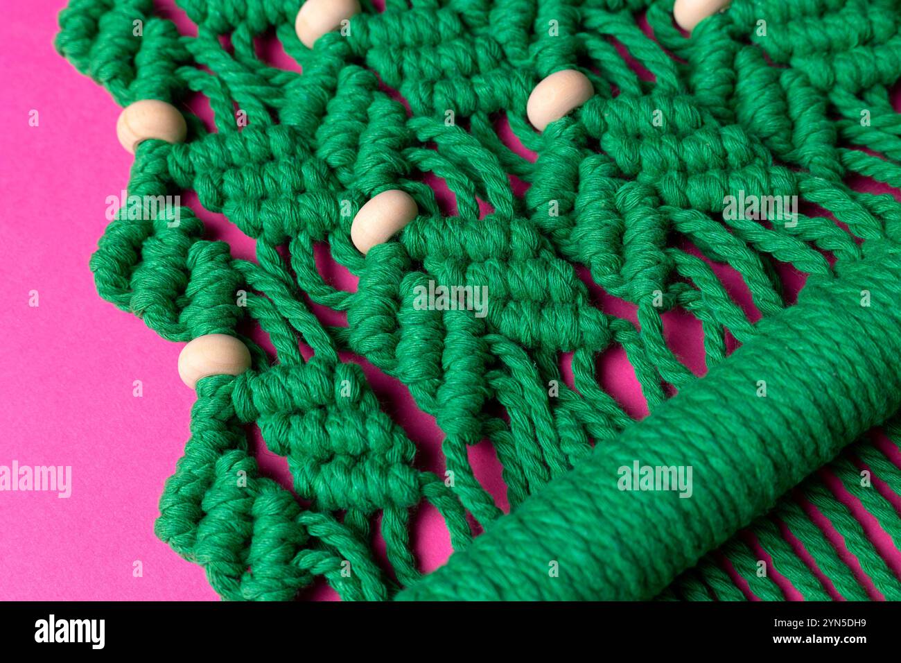 beautiful macrame panel Christmas tree on pink background Stock Photo ...