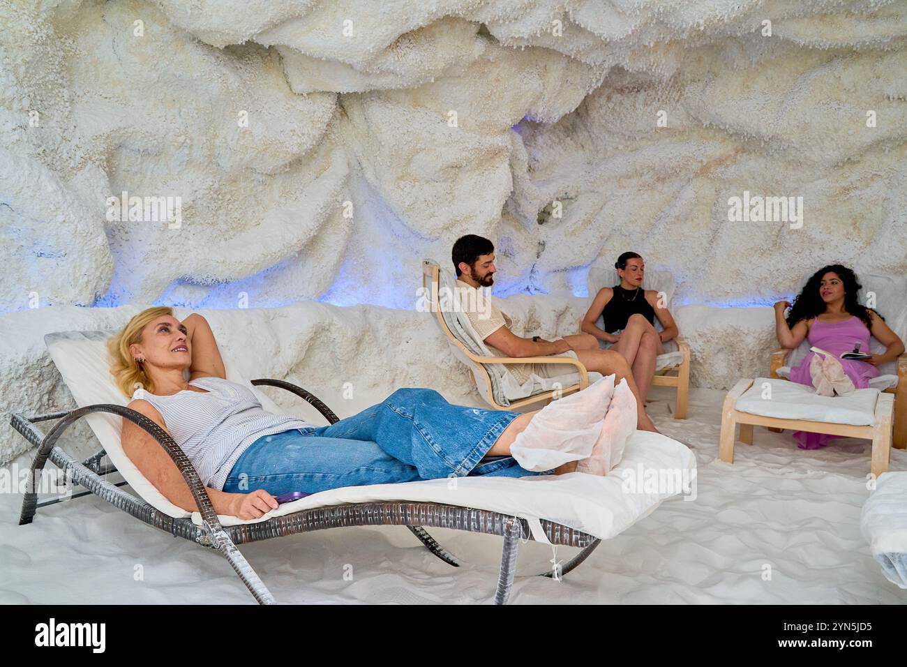 Group relaxing in a therapeutic salt cave session Stock Photo - Alamy