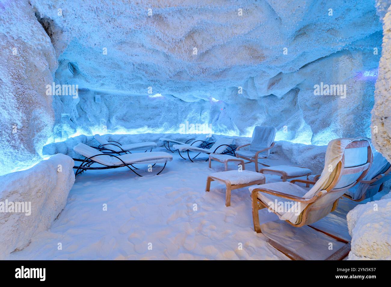 Interior of a salt cave with lounge chairs and atmospheric lighting ...