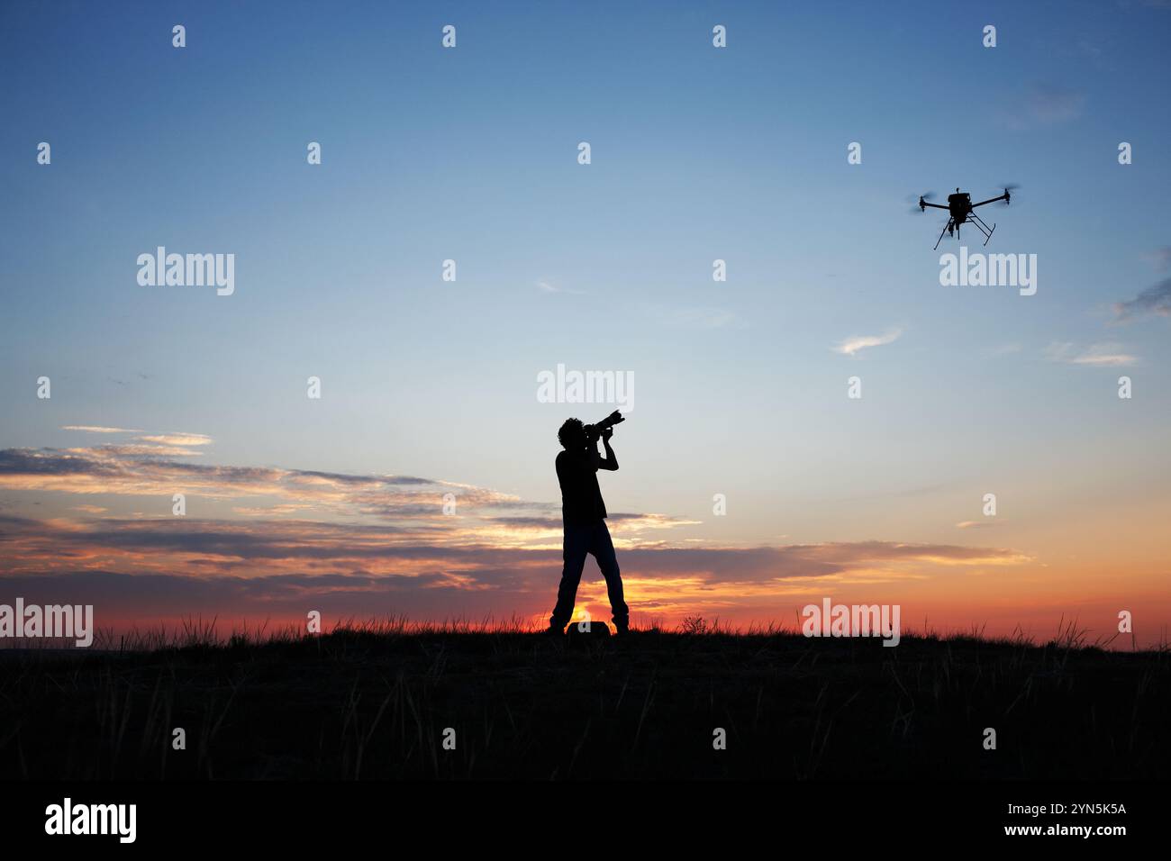 Man photographing a drone (UAV Stock Photo - Alamy