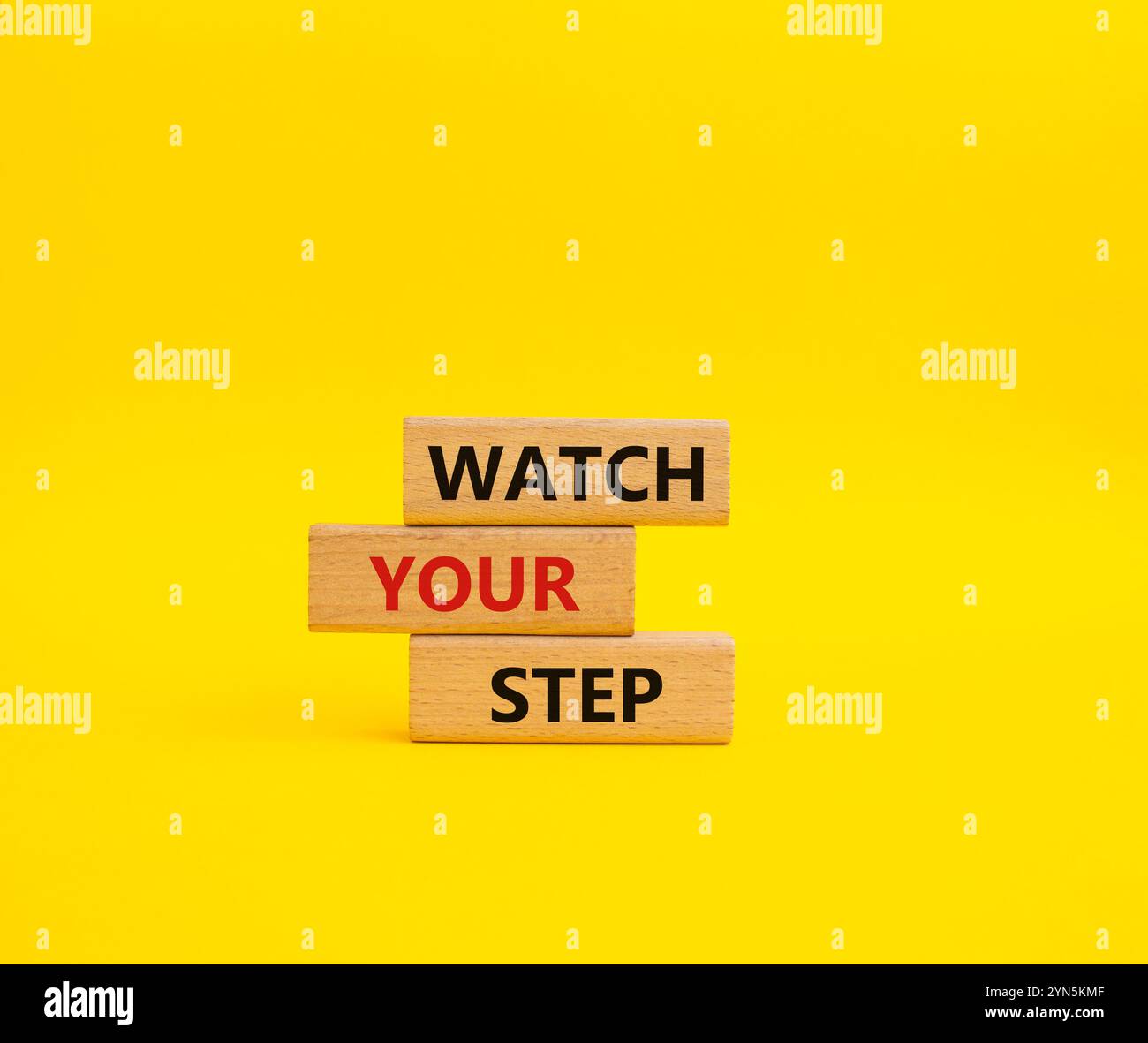 Watch your Step symbol. Concept words Watch your Step on wooden blocks ...