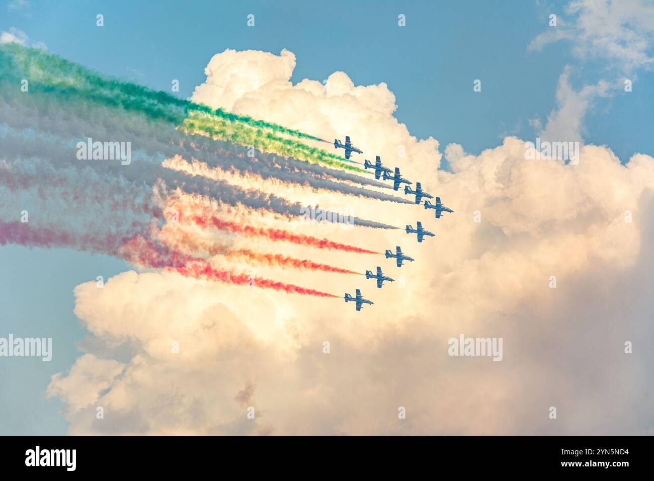 Fighter jets performing airshow with colorful exhaust streams in scenic ...