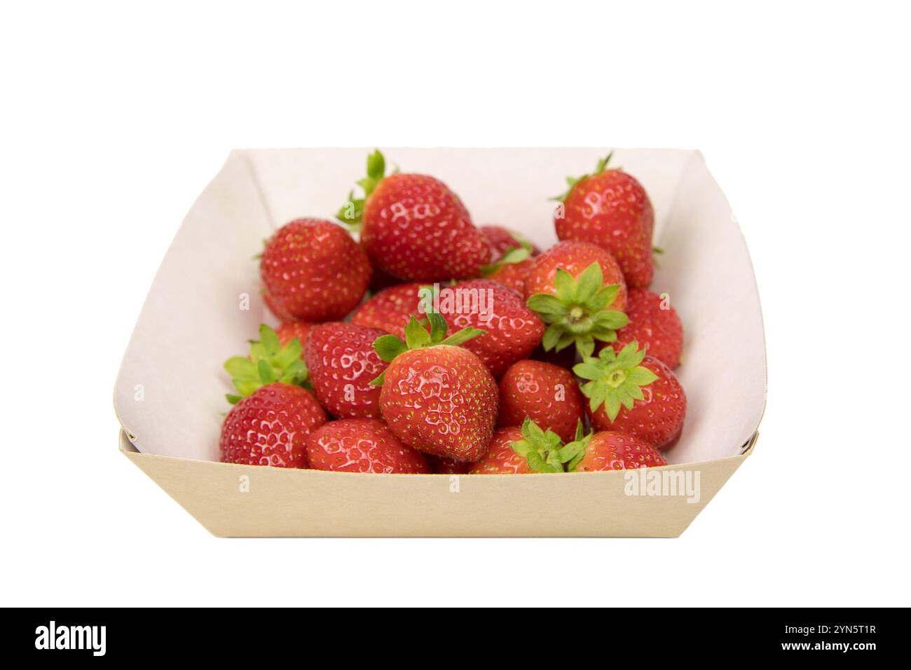 Ripe strawberries from the store, in an open cardboard tray. View from ...