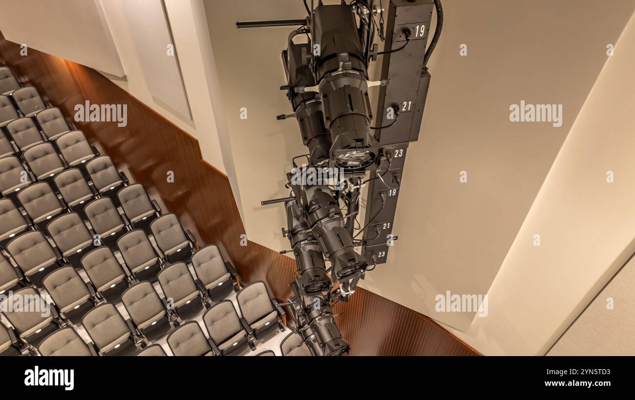 Close up photo of new large theater stage spotlights, lamps, hung on ...