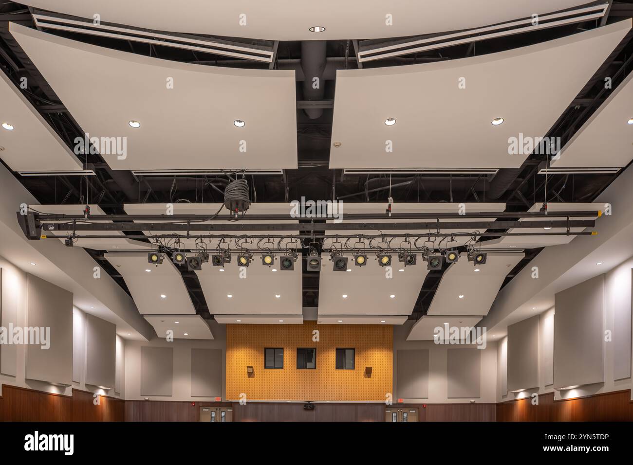Close up photo of new large theater stage spotlights, lamps, hung along ...
