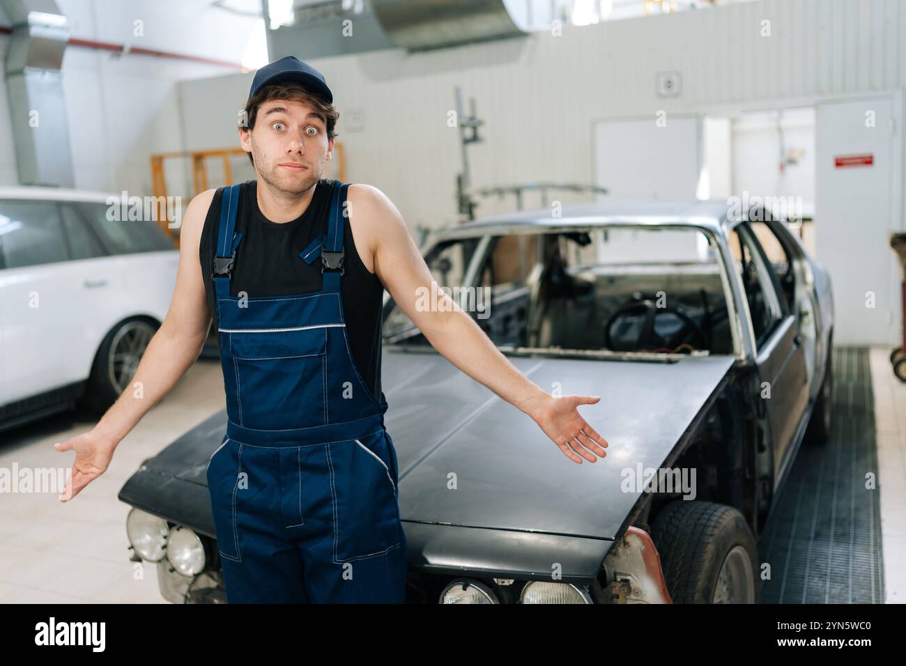Mechanic wearing workwear looking hi-res stock photography and images ...