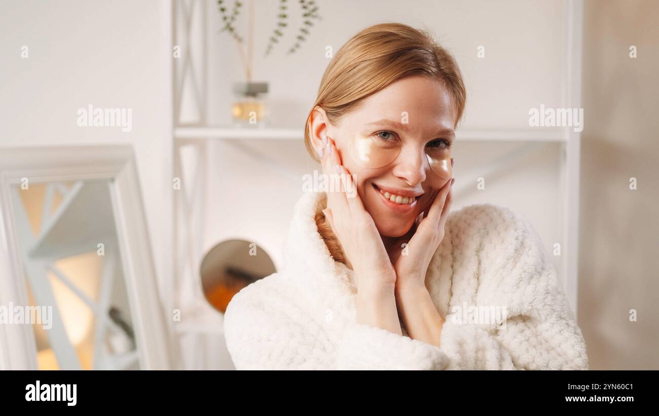 Happy spa. Woman beauty. Inspired young smiling girl with natural makeup collagen hydrogel ...