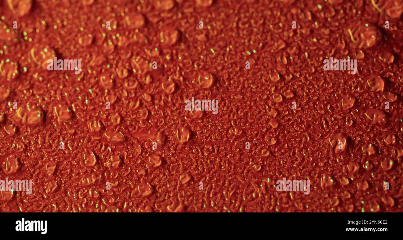 Moist surface. Orange drops. Fine dew flow formation on uneven opaque ...