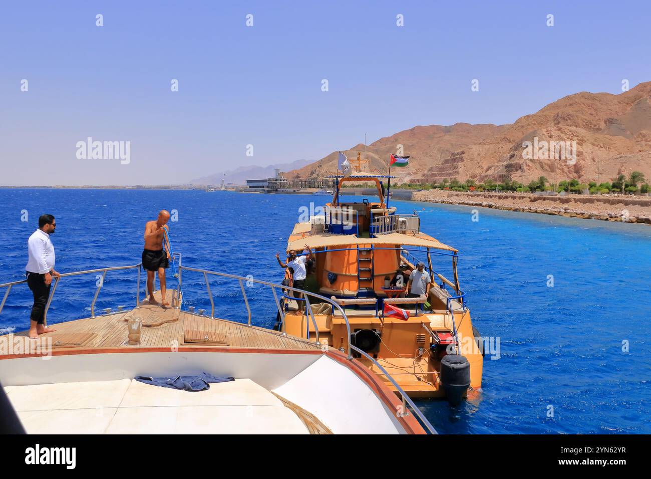 Aqaba in Jordan - May 17 2024: people enjoy a boat trip at the Gulf of ...